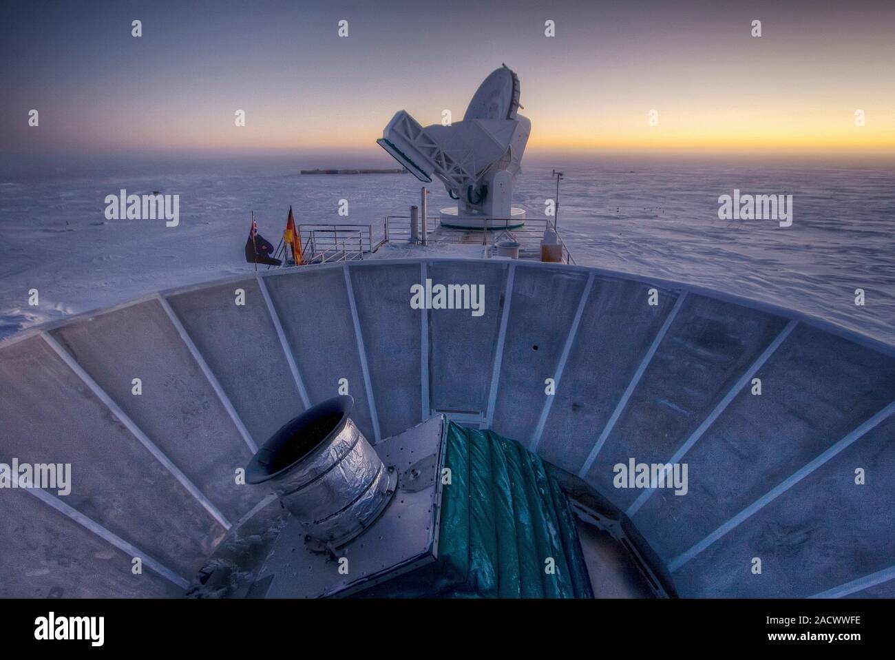 BICEP2 telescope (foreground) at sunset in the Antarctic. The South ...
