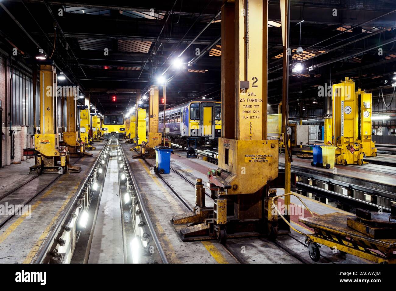 Railway service and maintenance depot with illuminated inspection pits ...