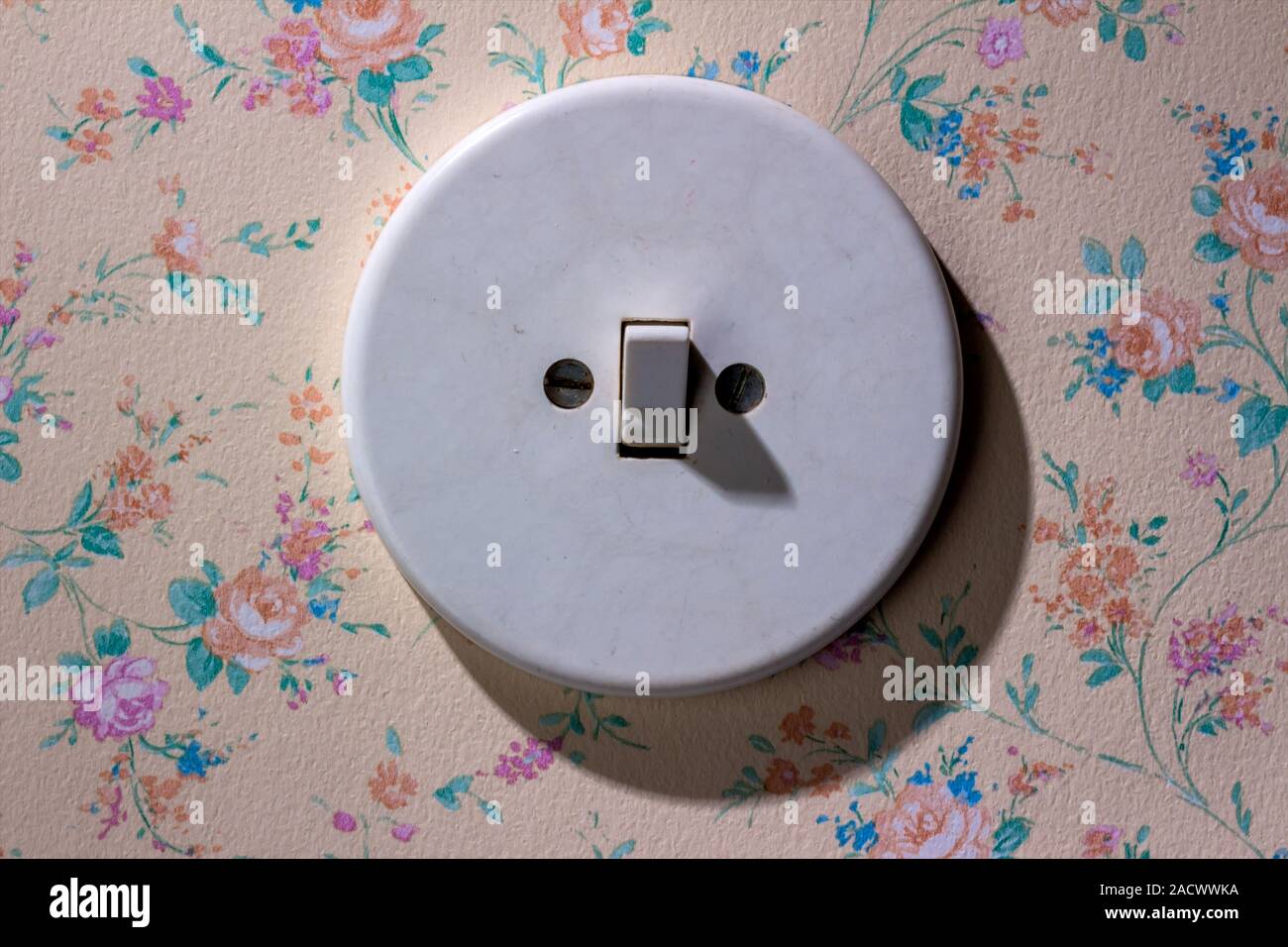 Old wallpaper with light switch Stock Photo - Alamy