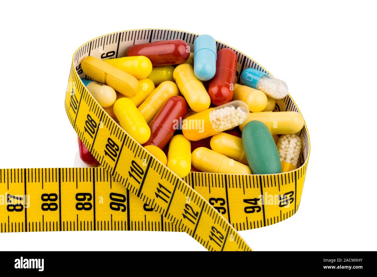 Tablets and measuring tape Stock Photo - Alamy