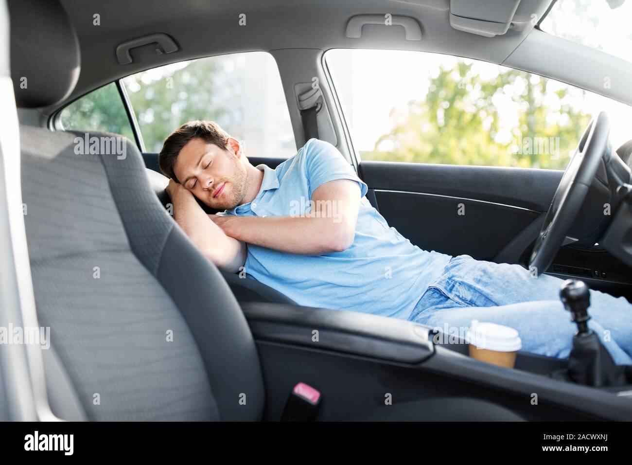 transport, rest and driving concept - tired man or driver sleeping in ...