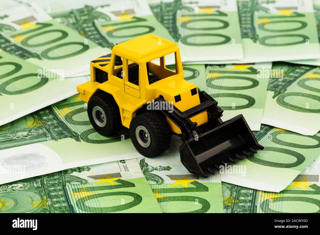Excavators on euro banknotes Stock Photo - Alamy