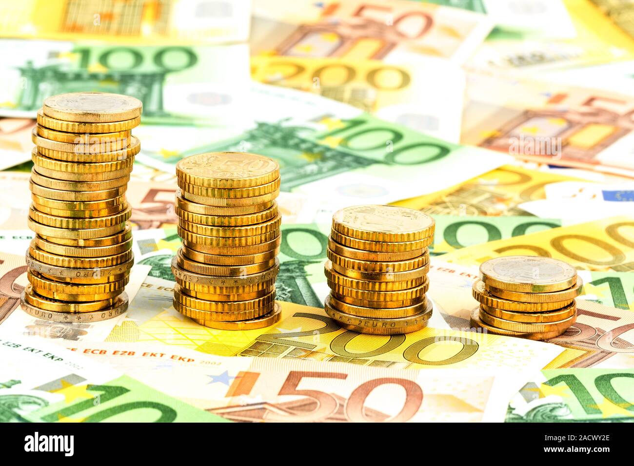 Stack of money coins, sinking curve Stock Photo - Alamy