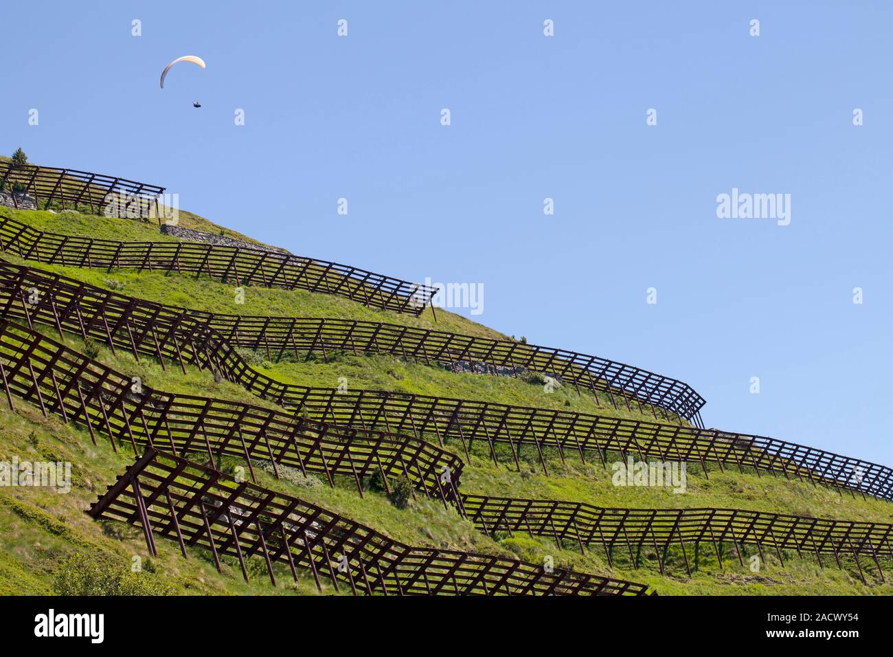 Avalanche barriers. Permanent fencing on a mountainside, designed to ...