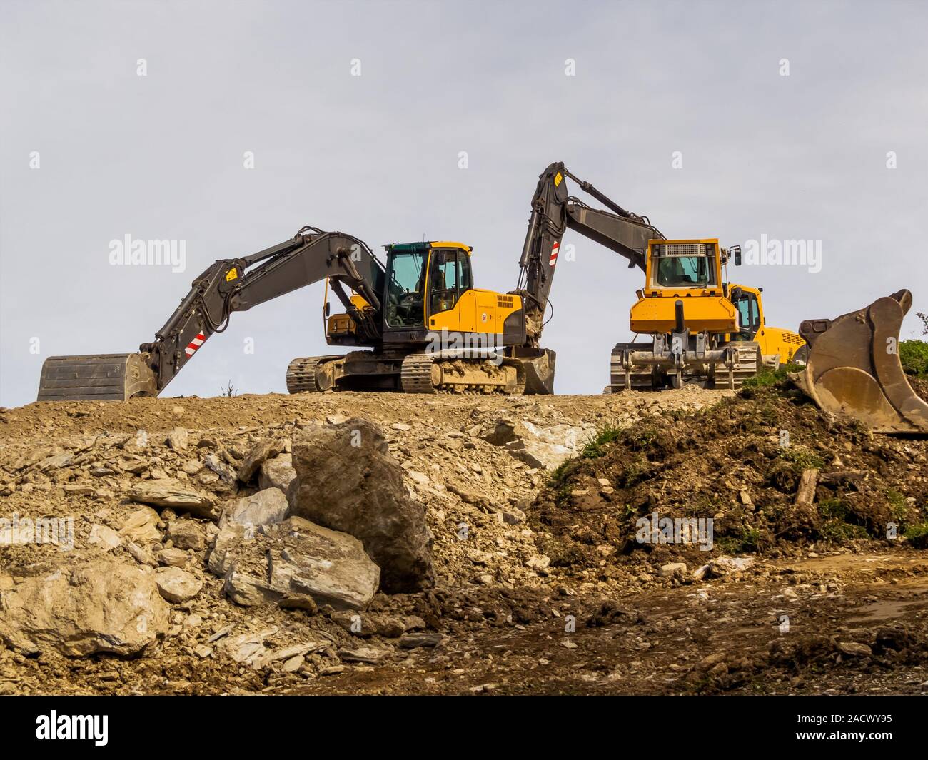 Excavator on a road construction site Stock Photo - Alamy