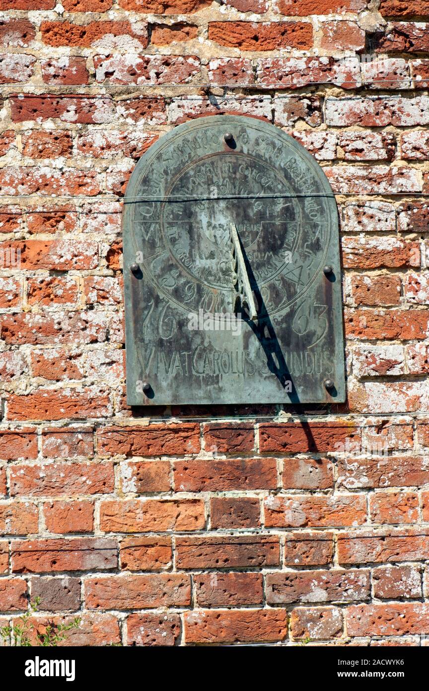 Antique garden sundial. This vertical sundial design was originally ...