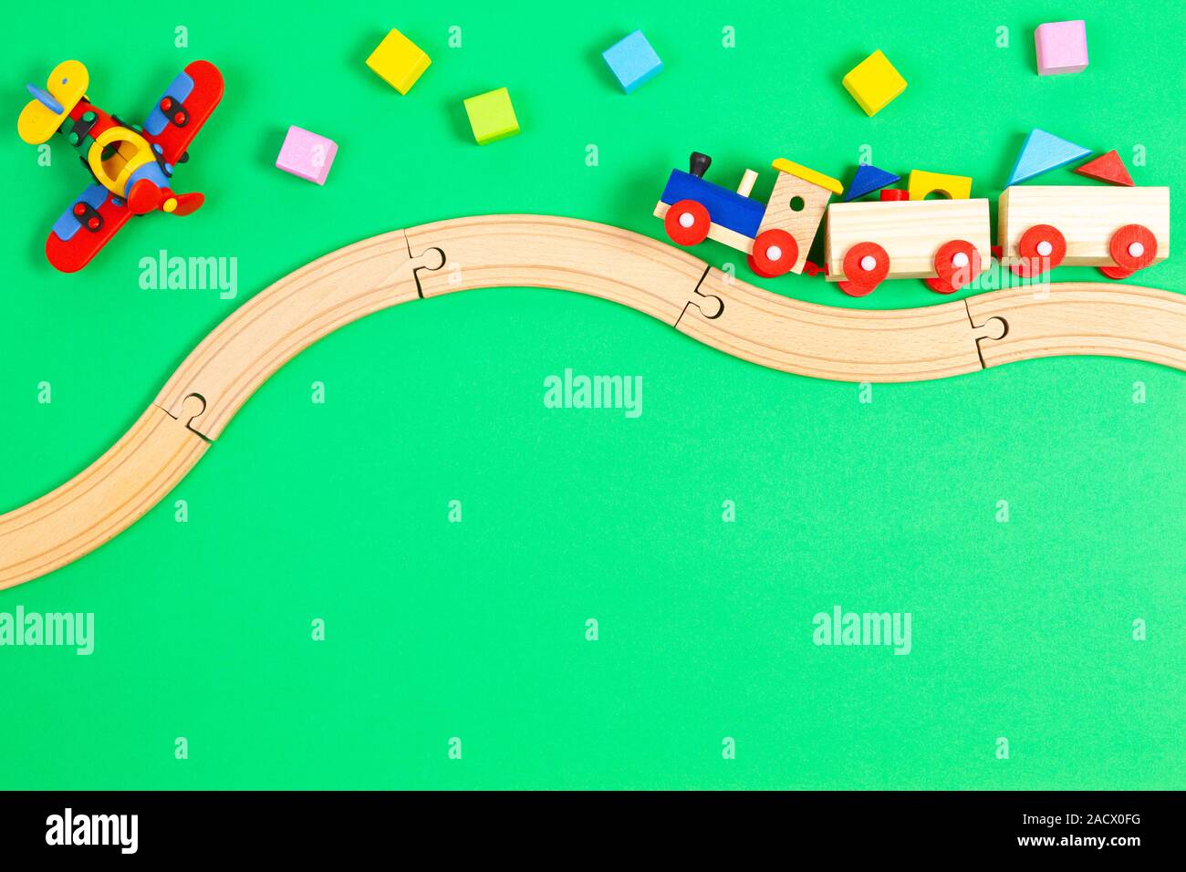 Wooden toy train with colorful blocks on wooden railway and red ...