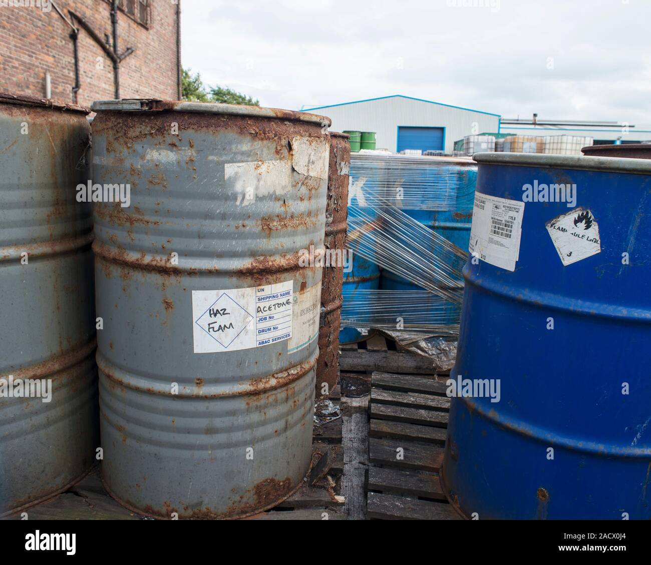 Hazardous industrial waste in compound, Liverpool Stock Photo - Alamy