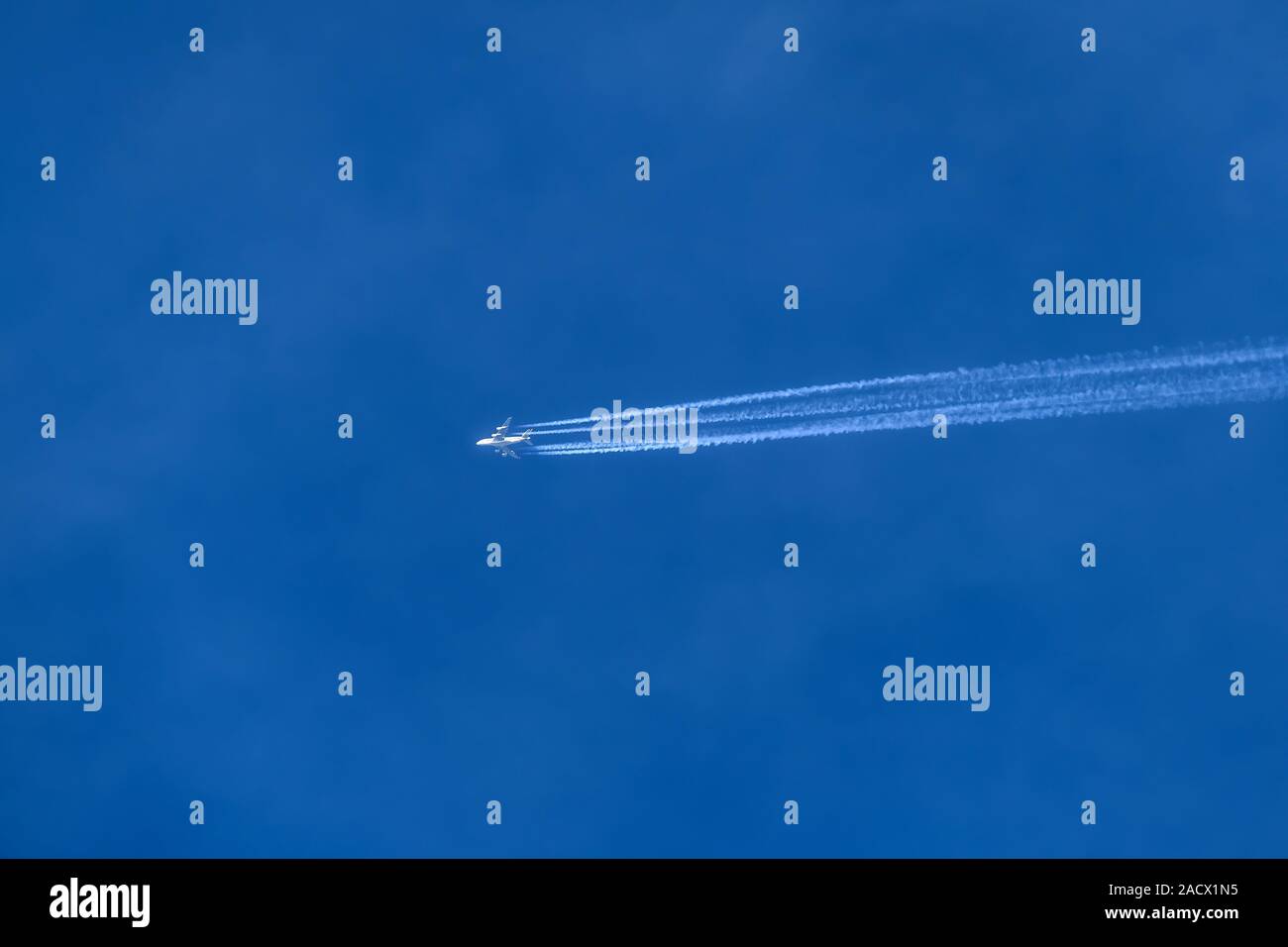 Condensation trails in the sky Stock Photo - Alamy