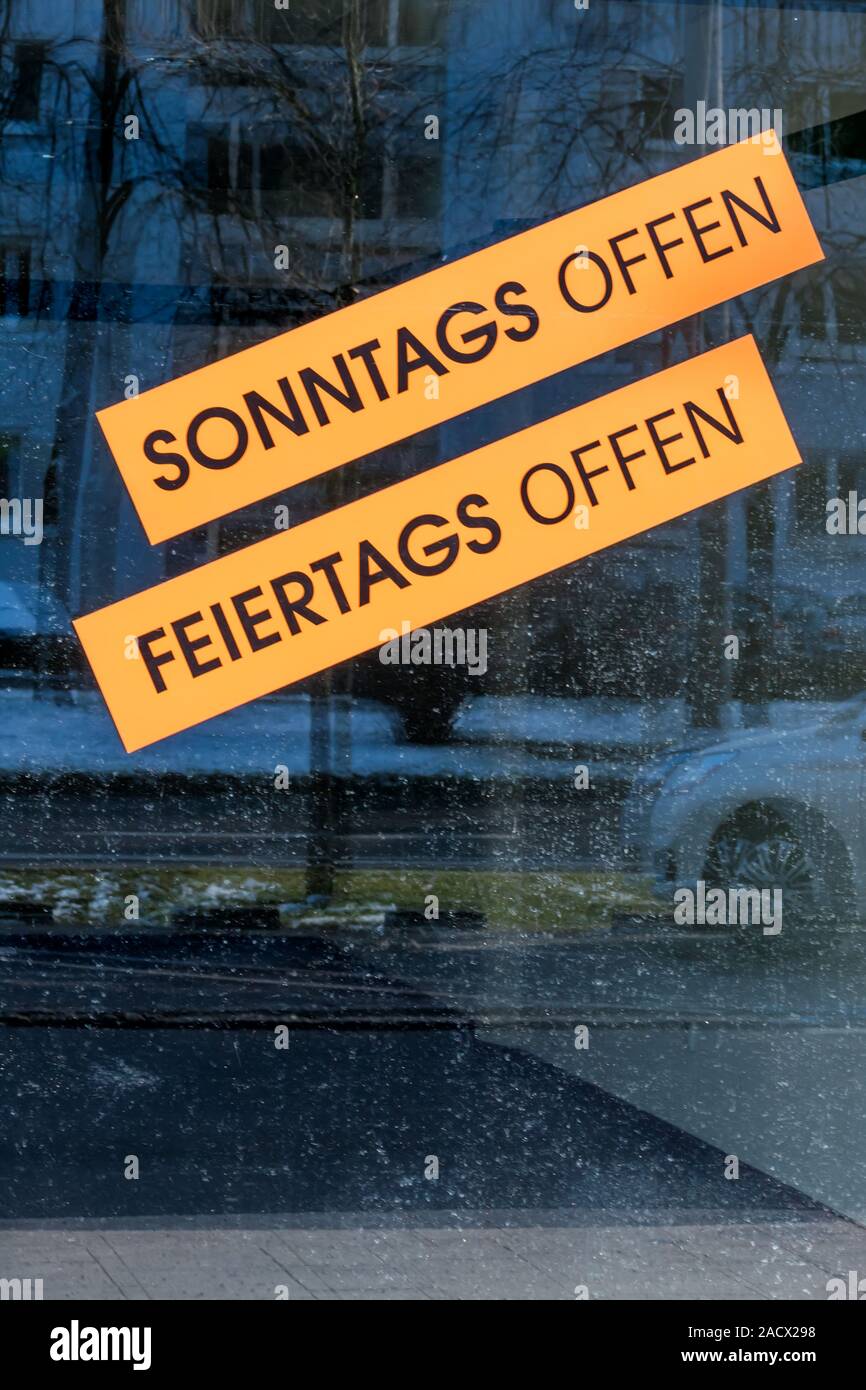 Signs Sundays holidays open Stock Photo - Alamy