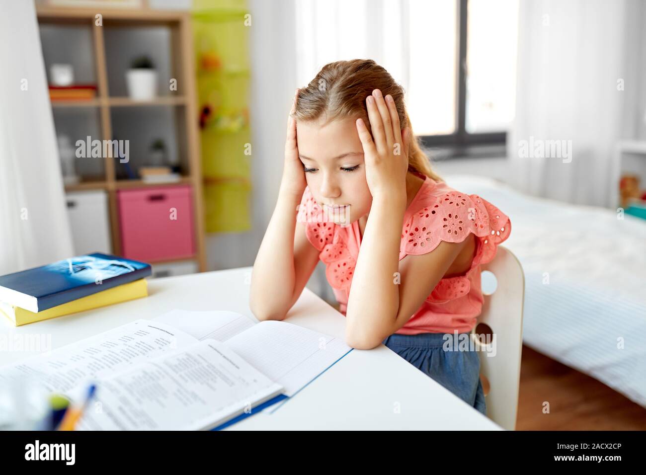 children, education and learning concept - sad student girl with ...