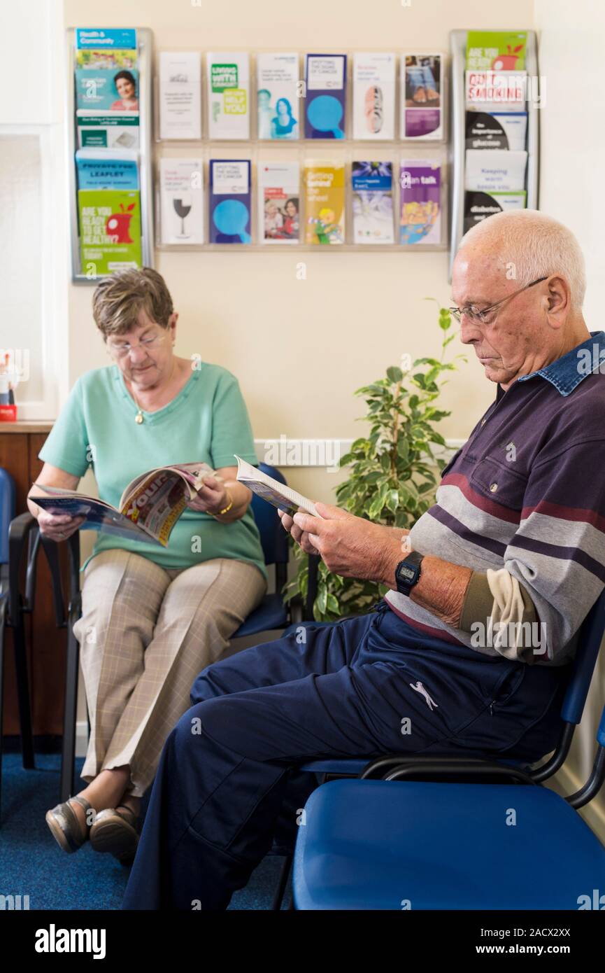 Two senior patients waiting to be seen at a general practice (GP ...