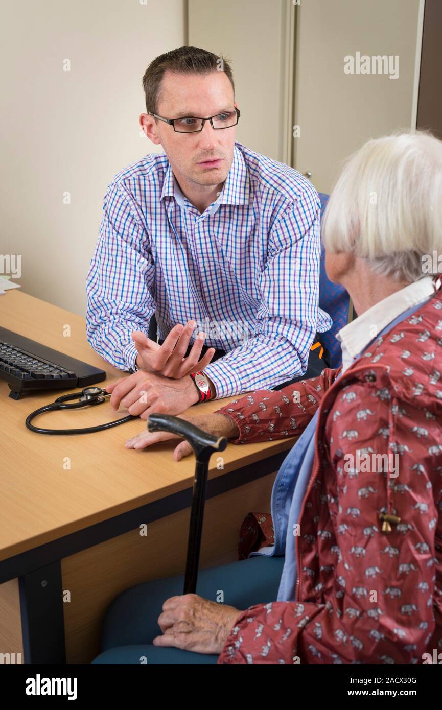 General practice (GP) doctor seeing an elderly female patient Stock ...