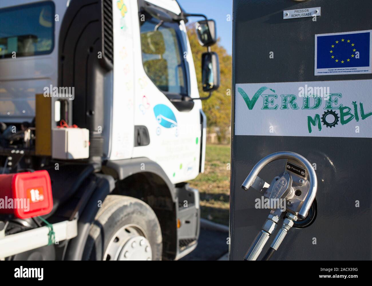 Biogas-powered truck at a filling station. Biogas (methane and carbon ...