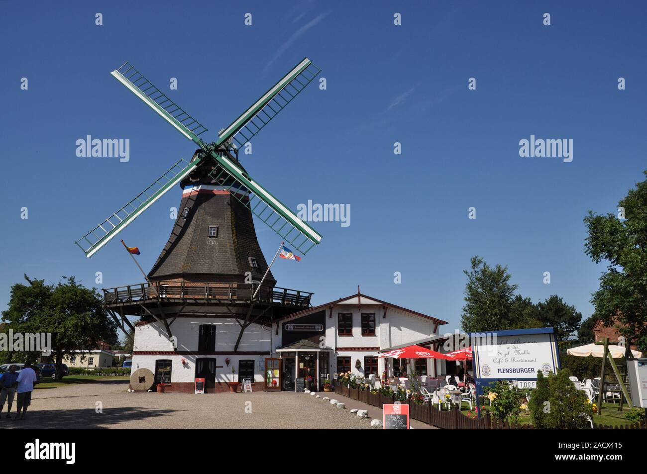 Windmill on northern beach Stock Photo - Alamy