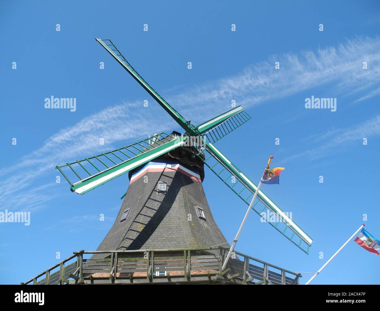 Windmill on northern beach Stock Photo - Alamy