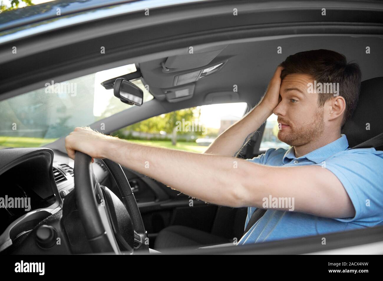 transport, vehicle and driving concept - tired sleepy man or car driver ...