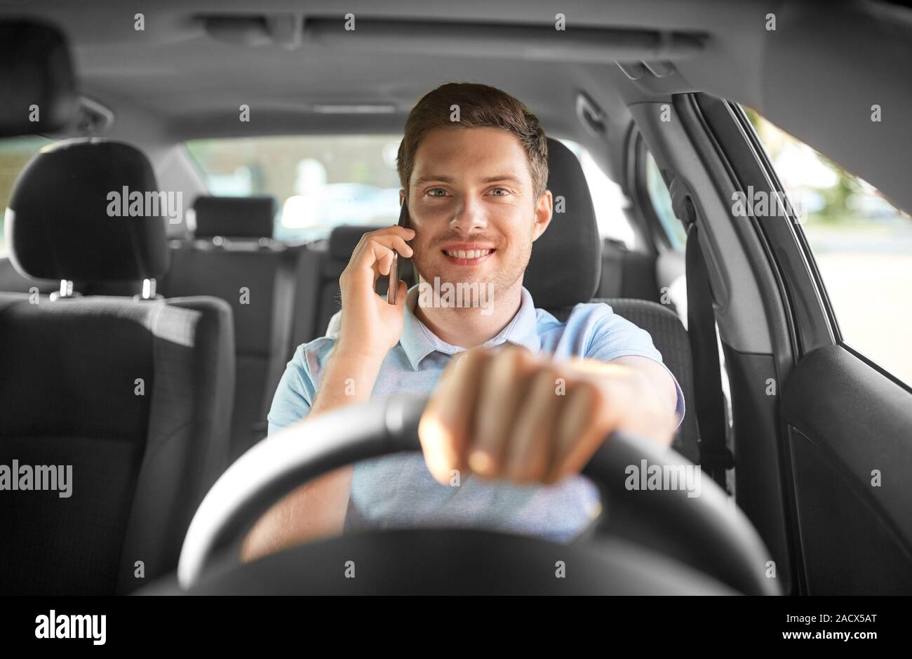 transport, vehicle and people concept - smiling man or driver driving ...