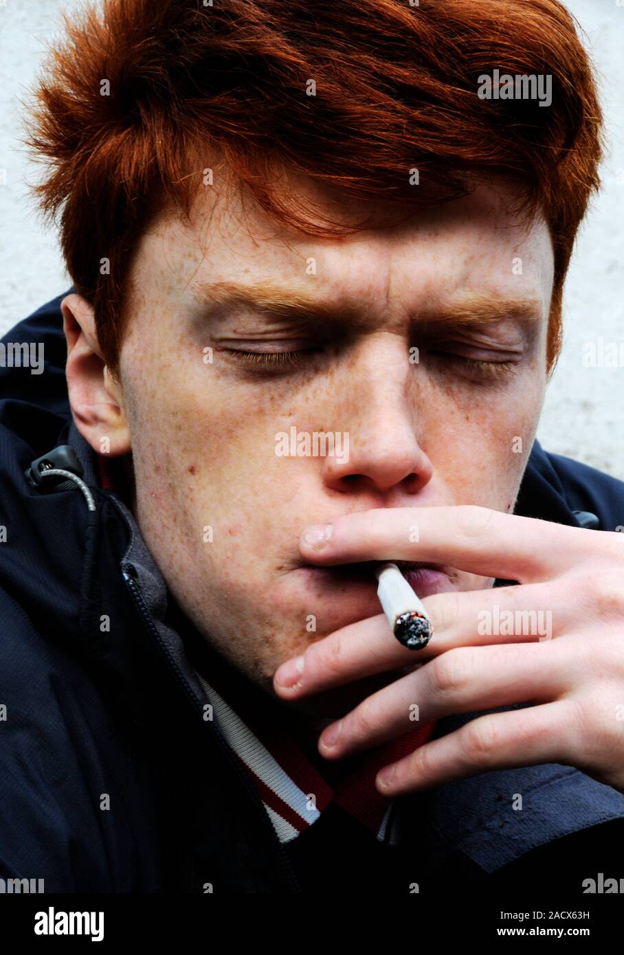 Teenager smoking. 18-year-old teenage boy smoking a cigarette Stock ...