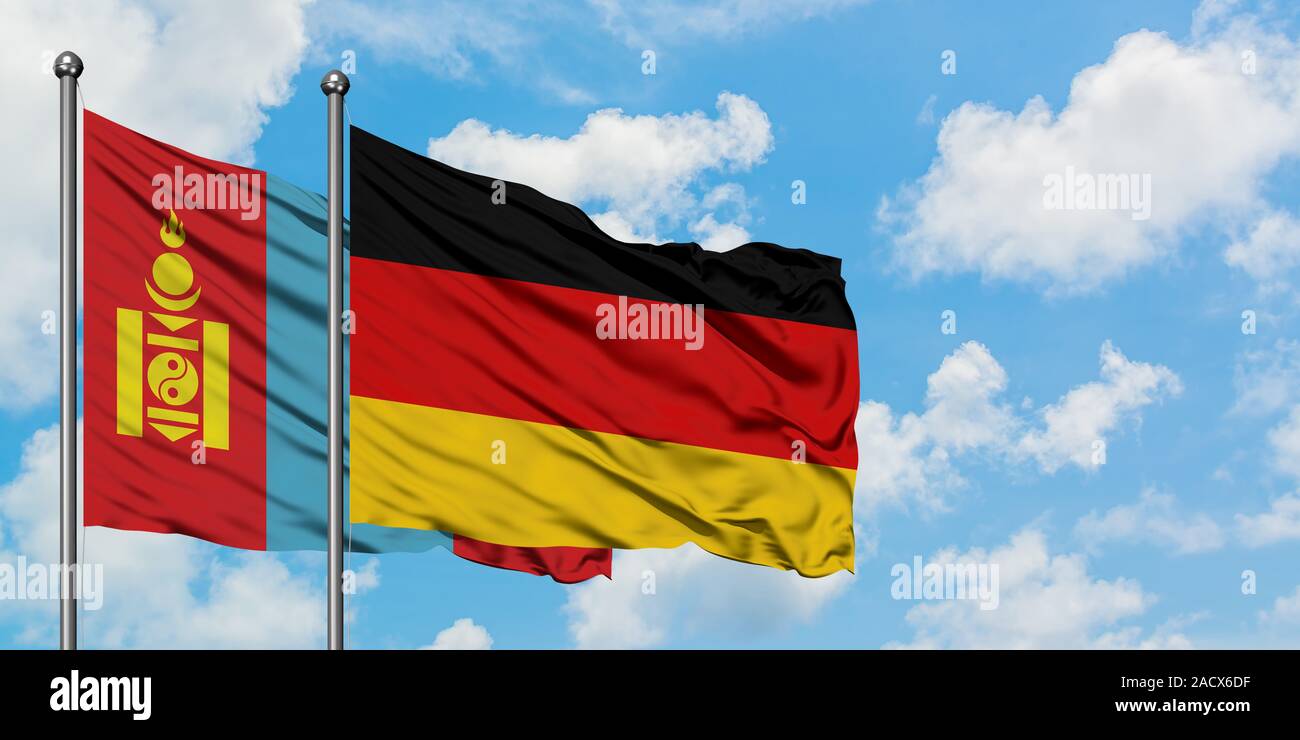 Mongolia and Germany flag waving in the wind against white cloudy blue ...