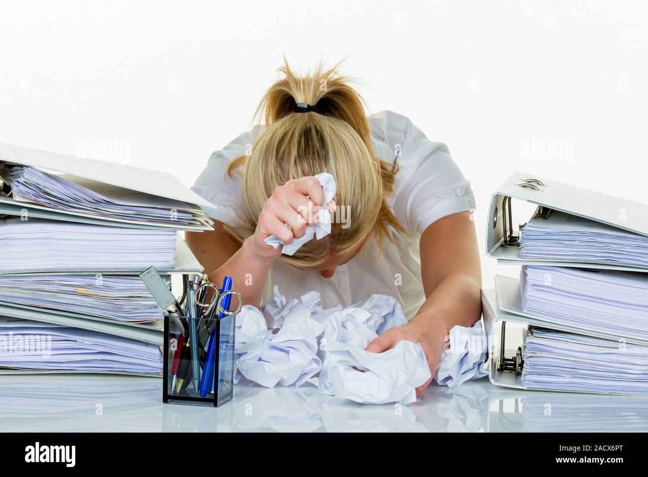 Woman in office with burnout Stock Photo - Alamy