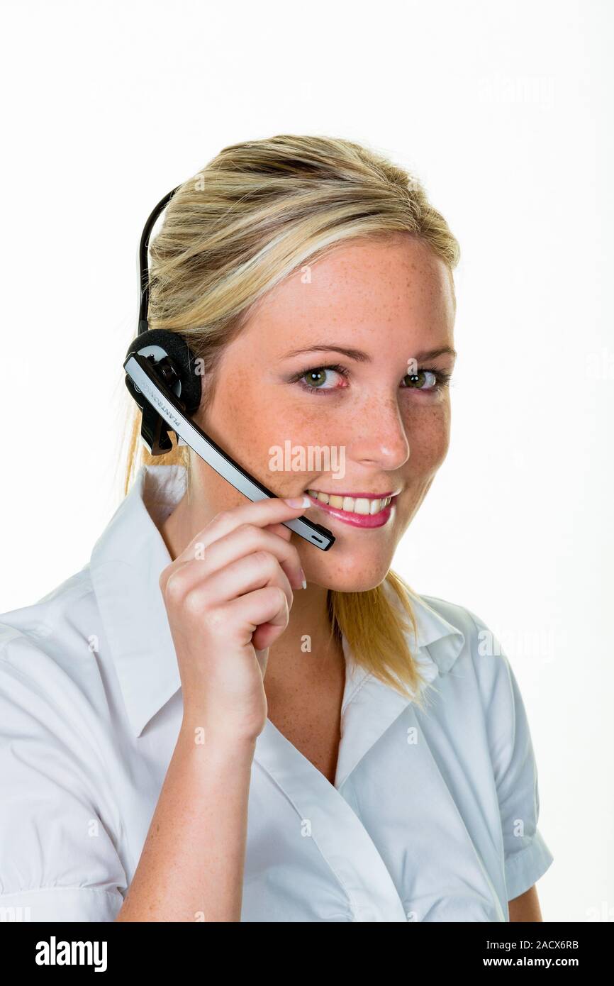 Woman with headset in customer service Stock Photo - Alamy