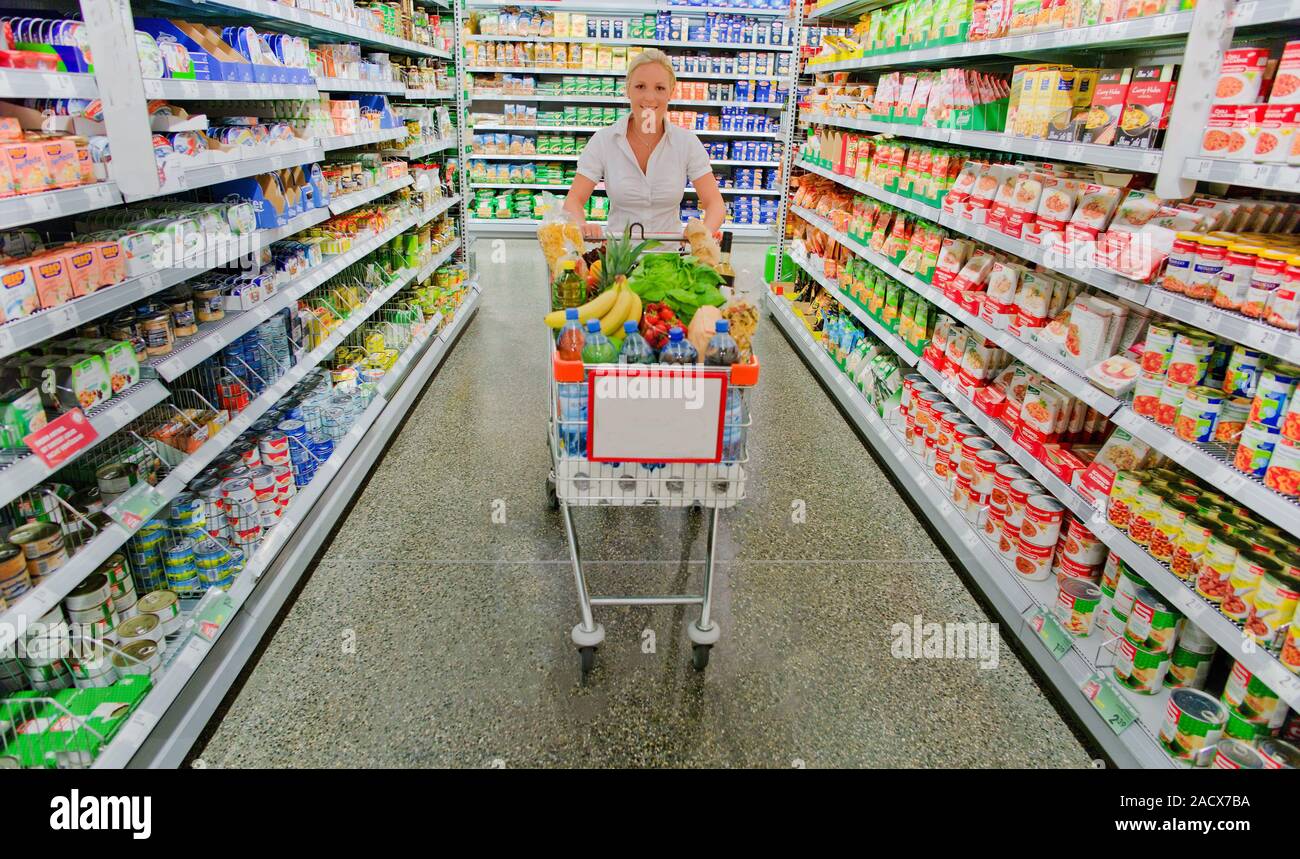 Woman shopping cart in hi-res stock photography and images - Alamy