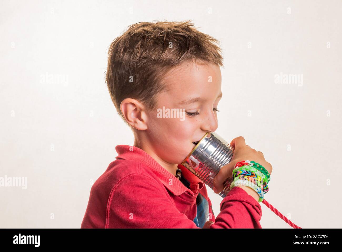 Child with a box telephone Stock Photo - Alamy