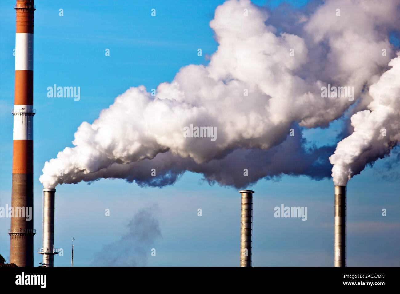 smoking chimneys of a factory Stock Photo - Alamy