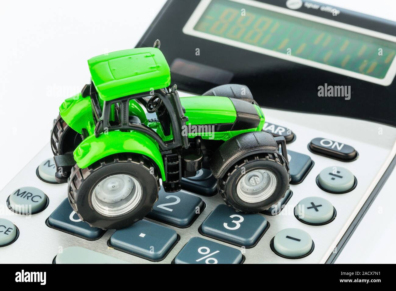Tractor and calculator Stock Photo - Alamy