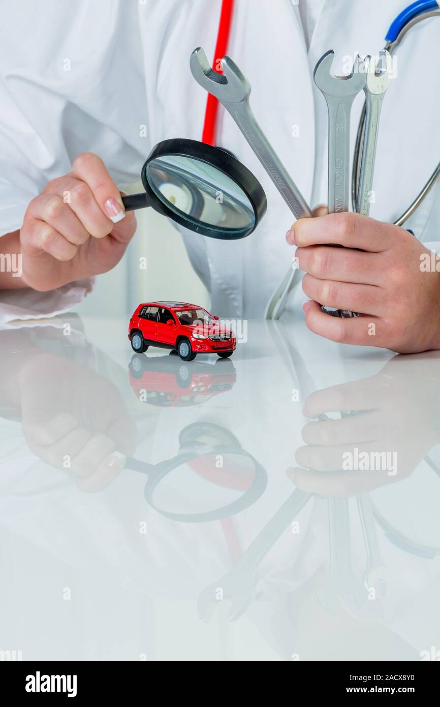 Car is examined by doctor Stock Photo - Alamy