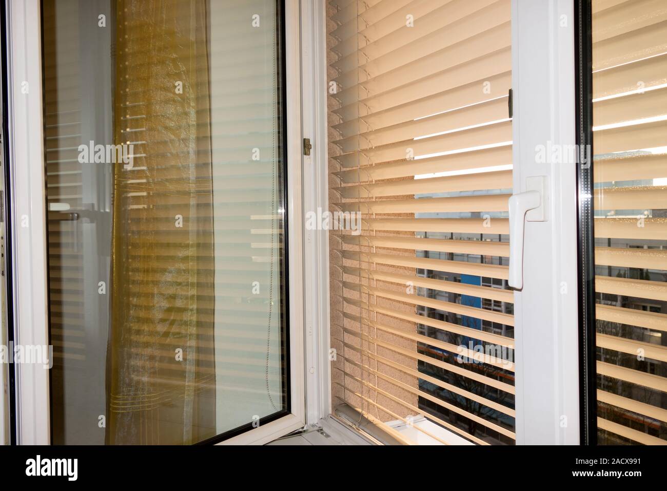 Venetian blinds as sun protection at the window Stock Photo - Alamy