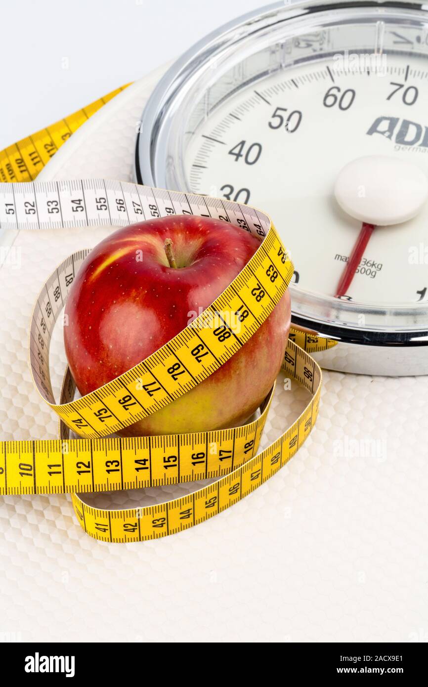 Apple on a scale hi-res stock photography and images - Alamy