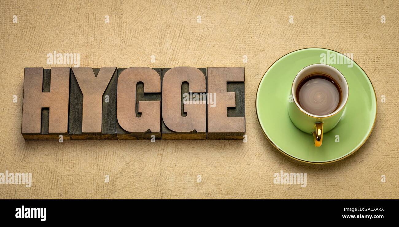 hygge word in vintage letterpress wood type blocks against handmade ...