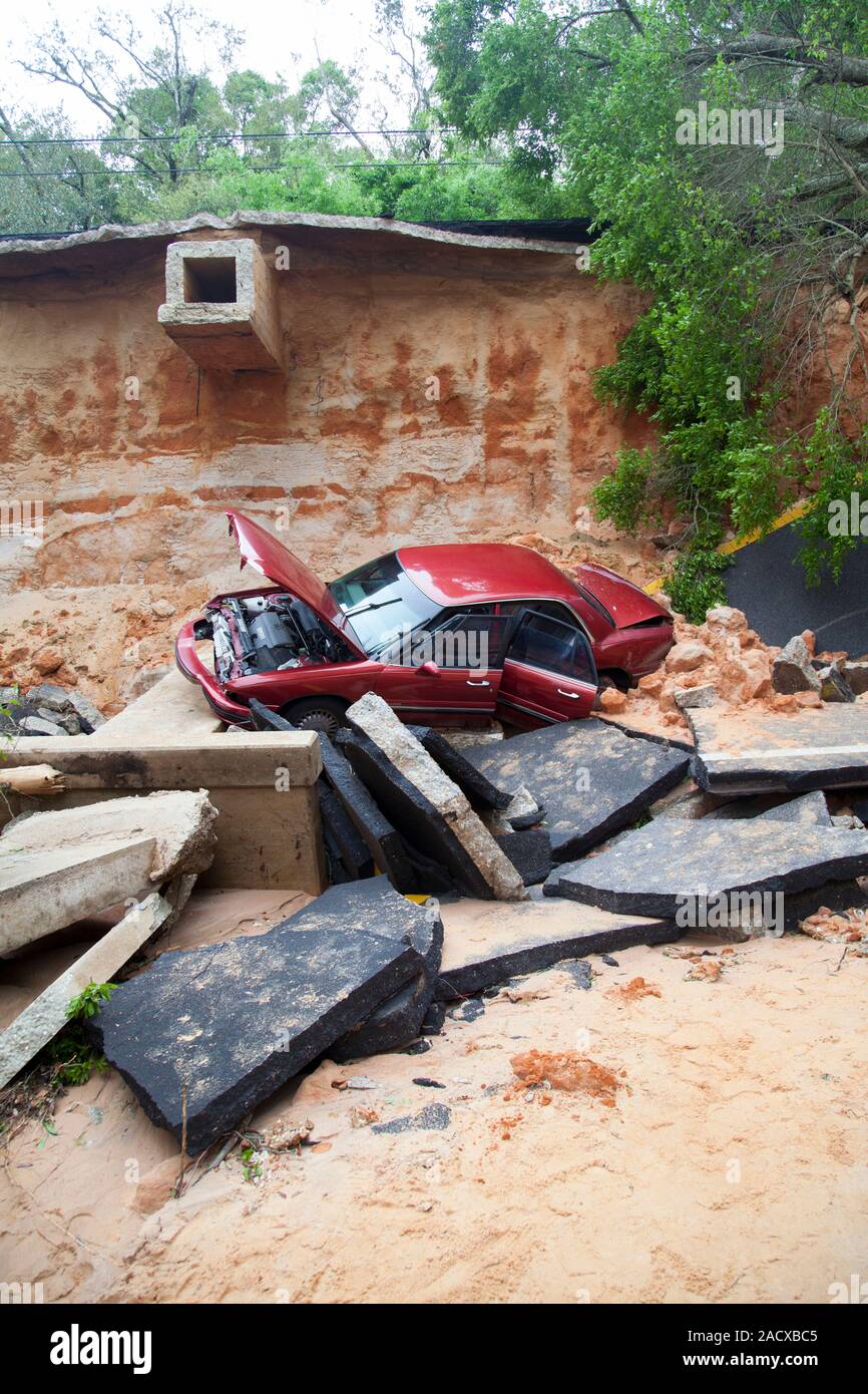 Car and road washed out by flooding. This road was destroyed by ...