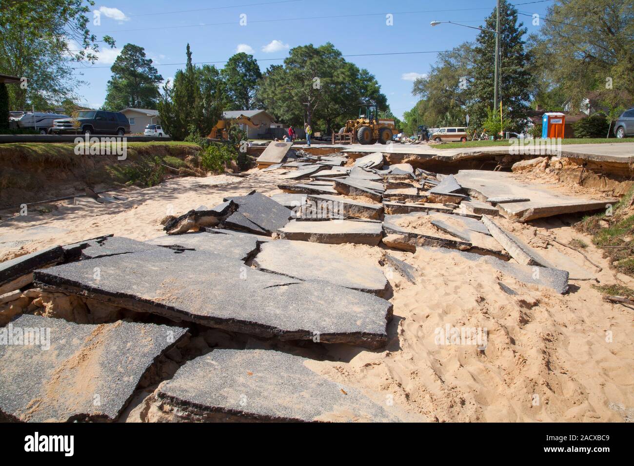 Road washed out by flooding. This road, in a residential neighbourhood ...