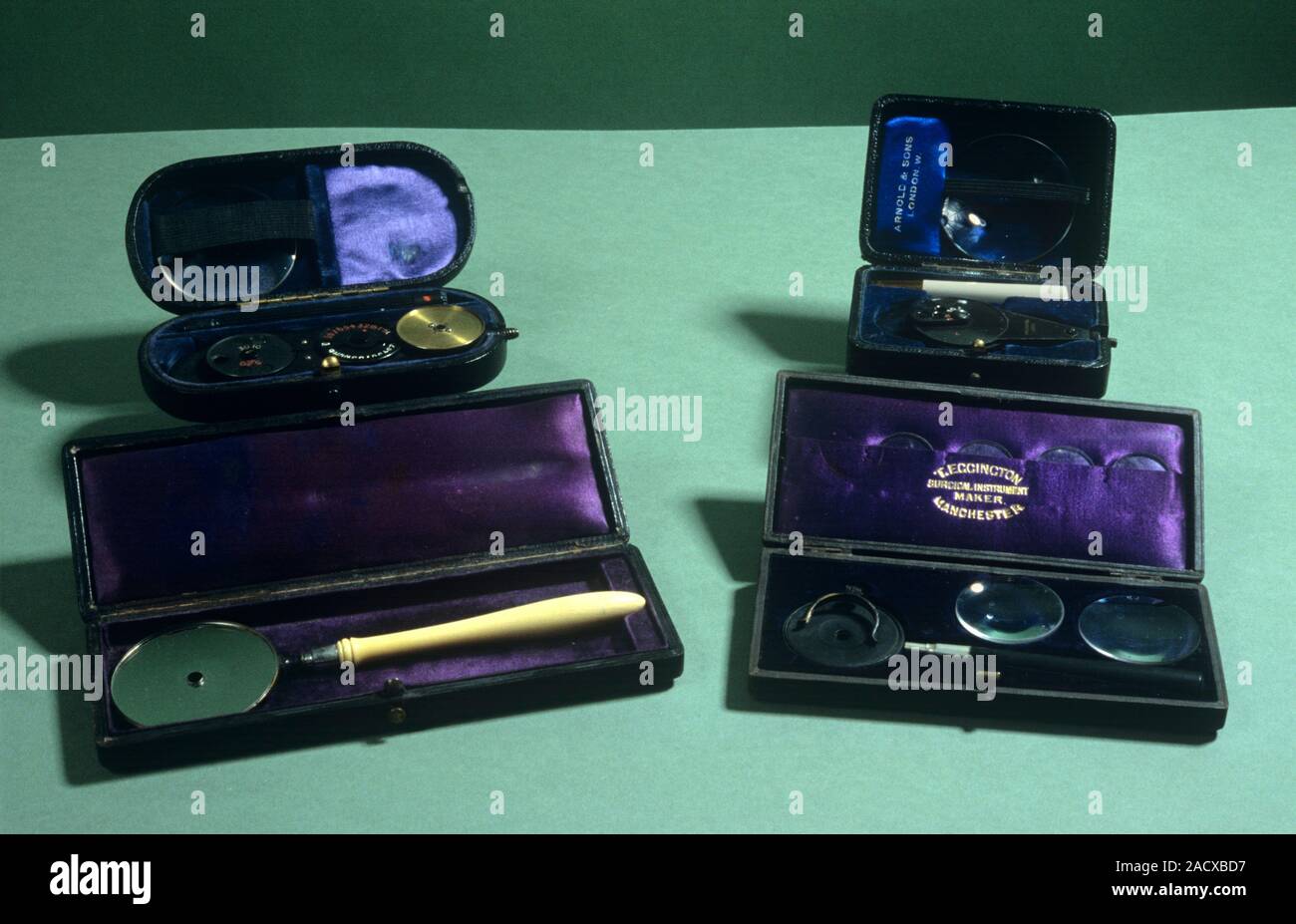 Three ophthalmoscopes and a retinoscope with ivory handle. These ...