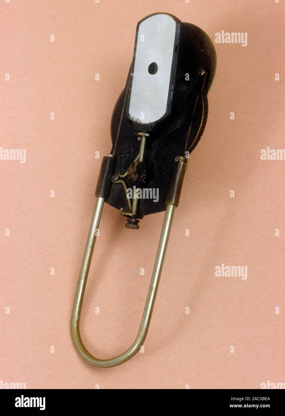 Metal and glass ophthalmoscope. The ophthalmoscope is used for the ...