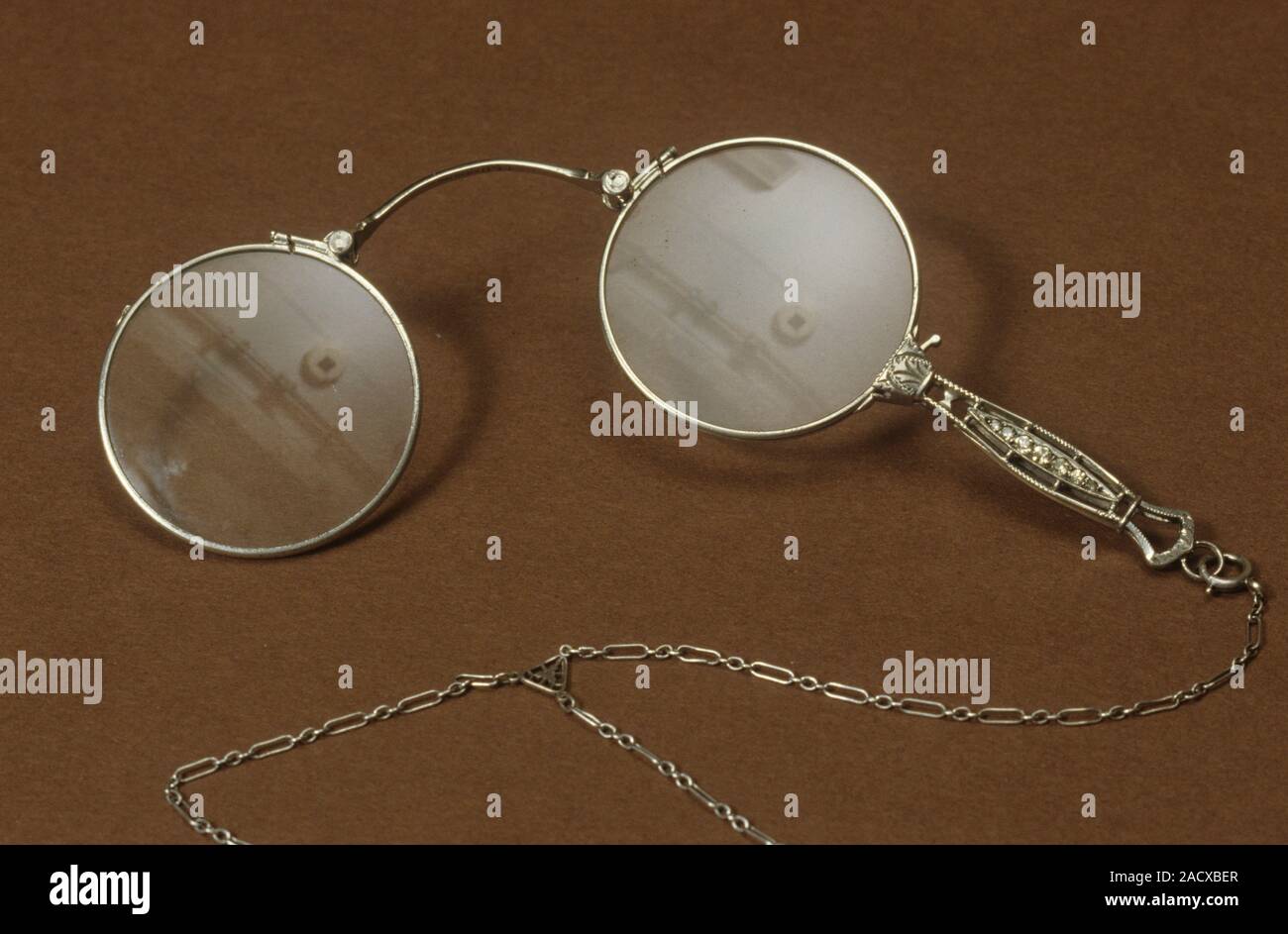 Silver lorgnettes. Lorgnettes consist of a spectacles front and a ...