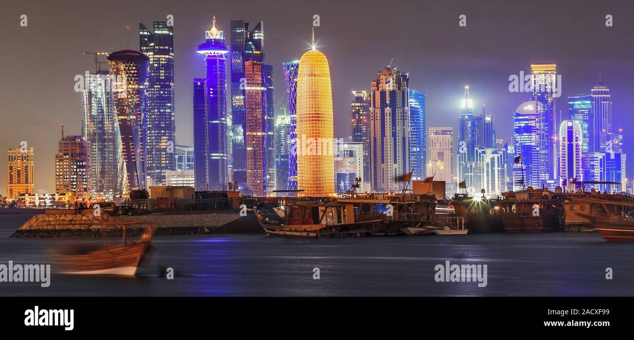 Night time skyline of Doha city centre, Qatar. The exploitation of ...