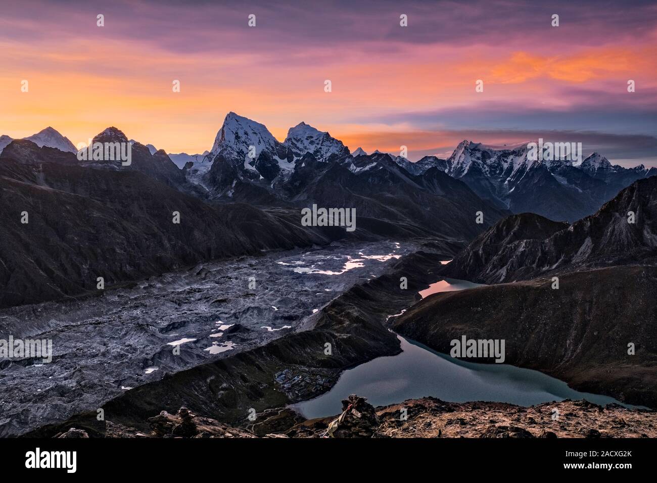 Panoramic aerial view over Gokyo Lake, the village and Ngozumpa glacier ...
