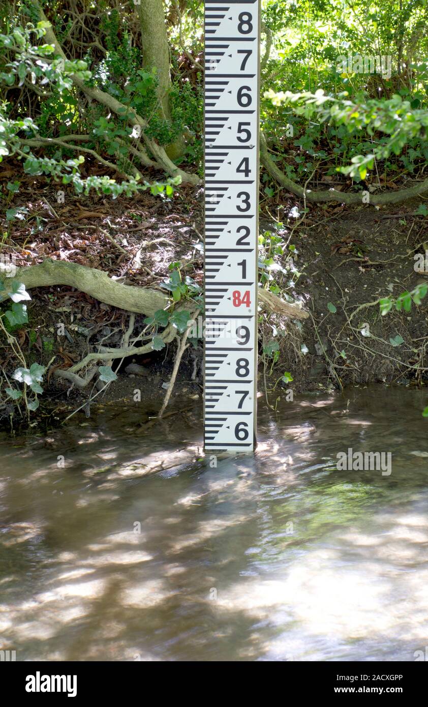River level indicator installed in an Oxfordshire chalk stream giving a ...