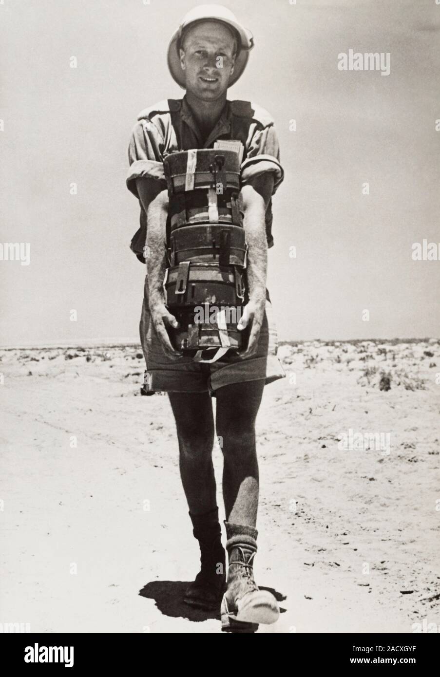 South African sapper carrying British mines in Egypt during World War ...