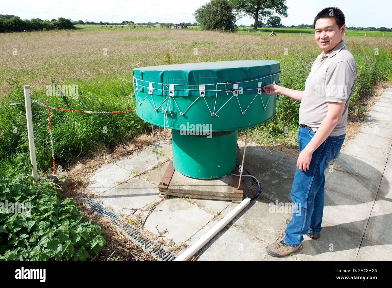 Insect radar research. Radar scientist Dr Jason Lim with a vertical ...