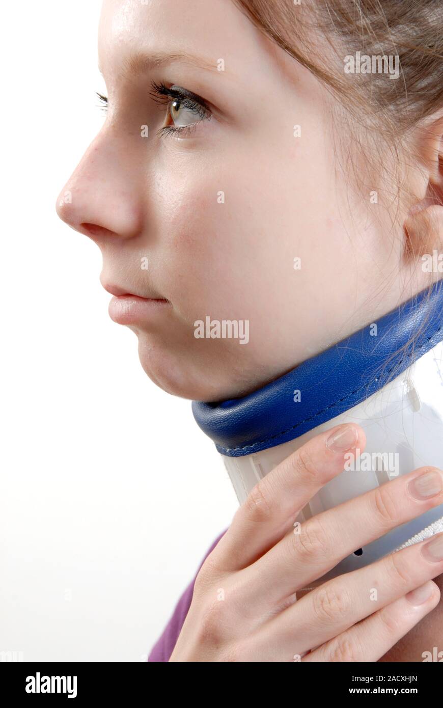 Neck brace being worn by a teenage girl to provide support and pain ...