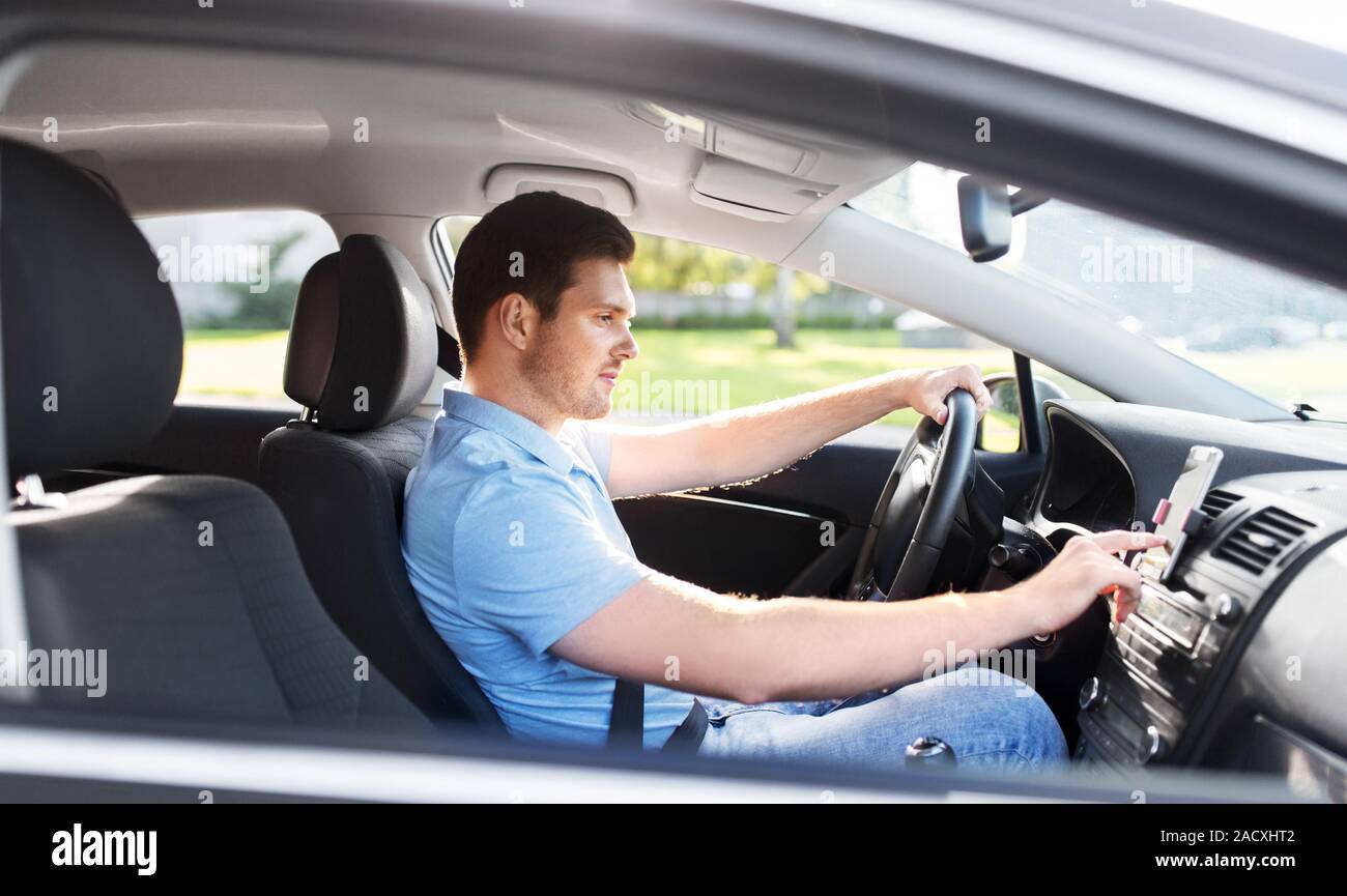 transport, vehicle and people concept - man or driver driving car and ...