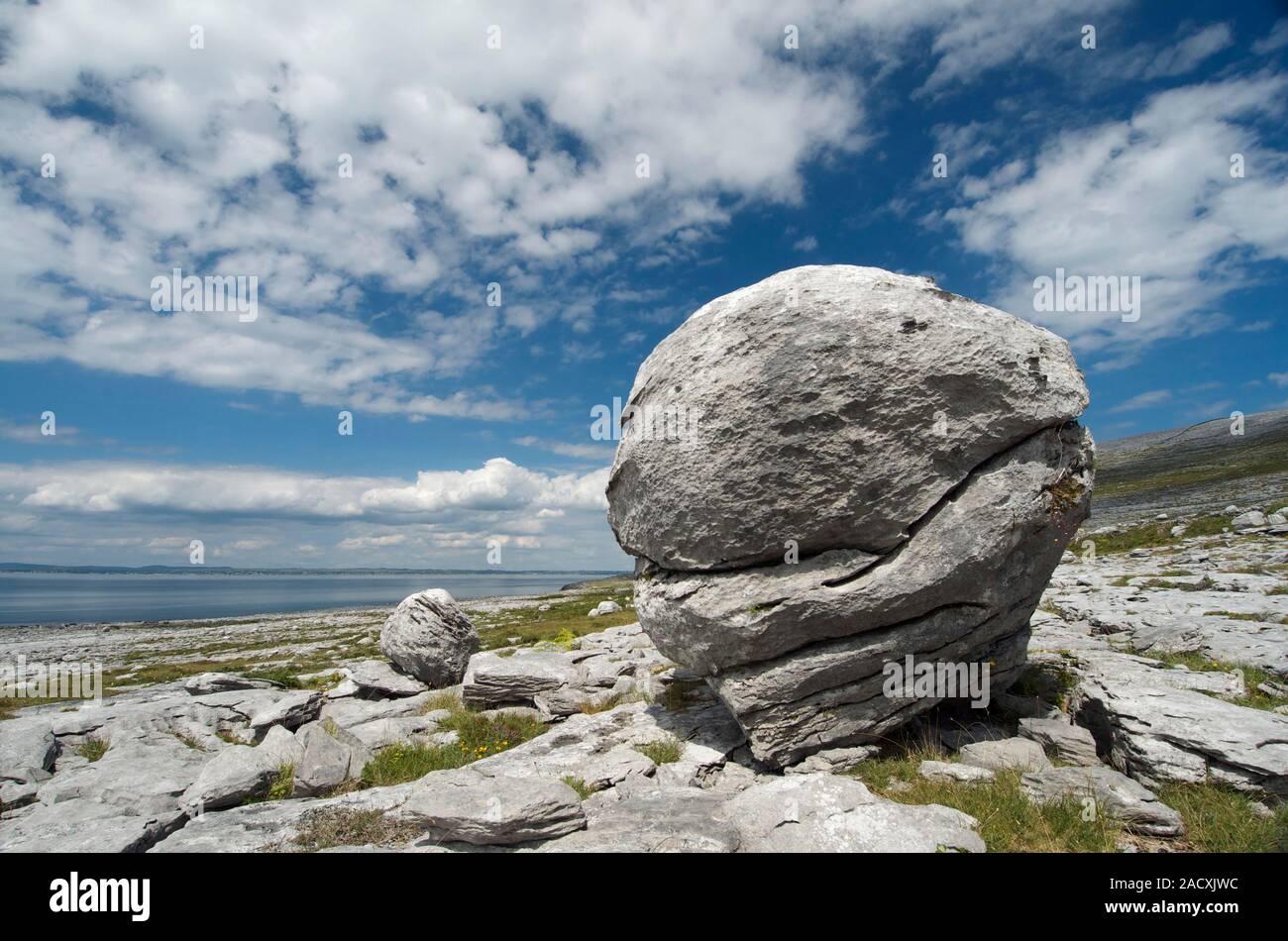 Limestone pavement with large boulder in the Burren, County Clare ...