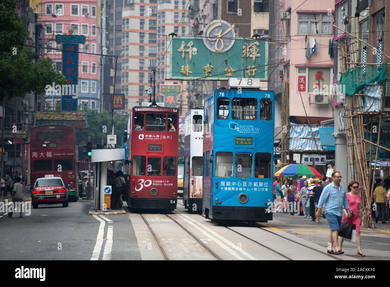 Double-decker electric trams. These vehicles run on rails in the road ...