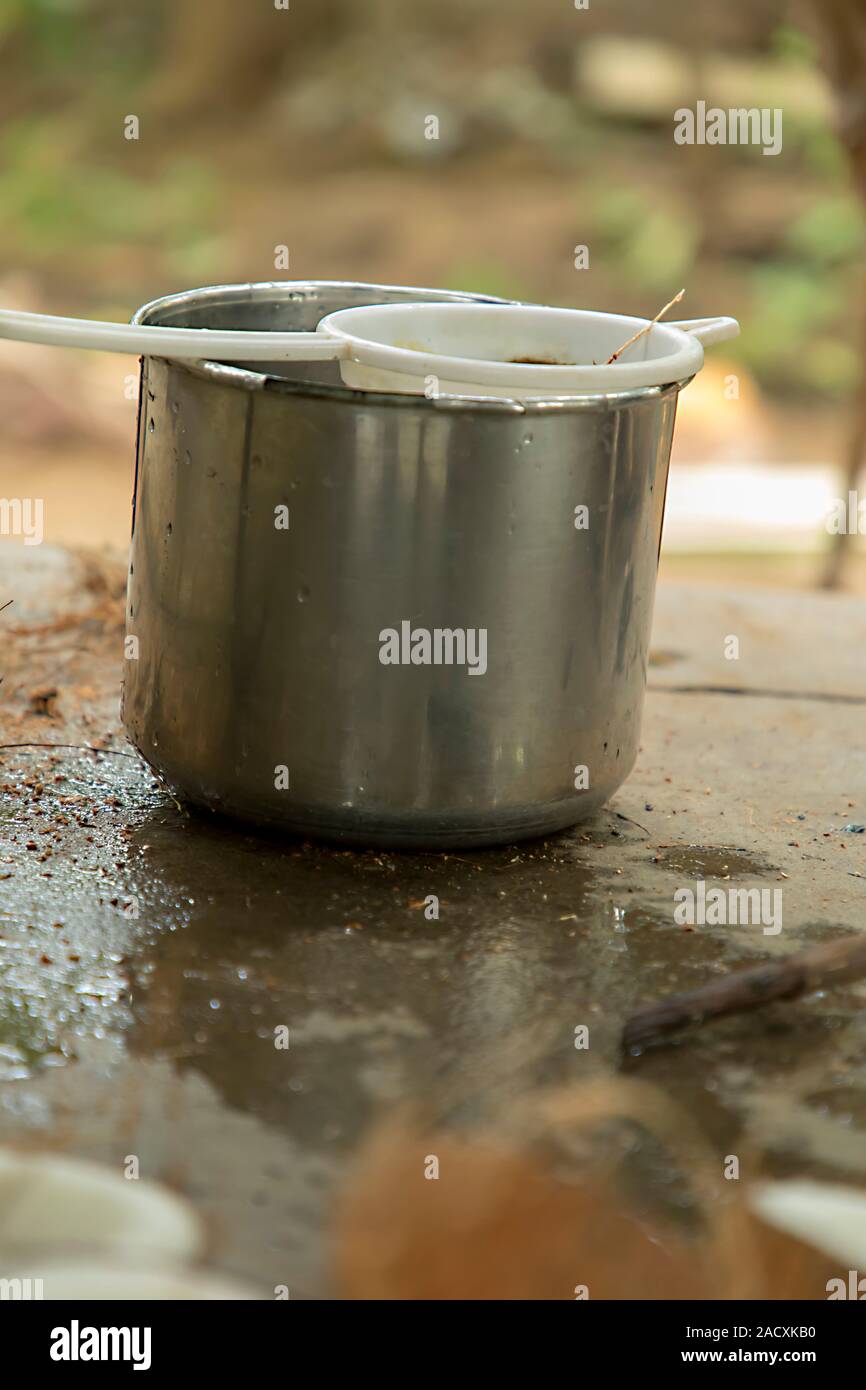 Closeup strainer with container and ground water leak Stock Photo - Alamy