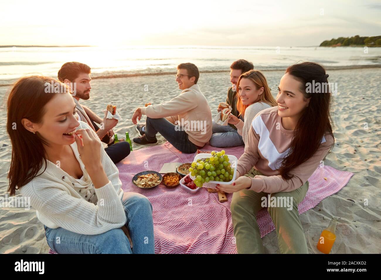 friendship, leisure and fast food concept - group of happy friends ...